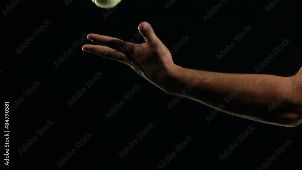 Tennis Ball being hit in slow motion against black background Stock ...