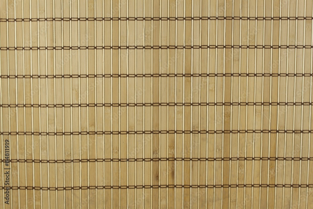 Bamboo mat as background. Detailed front view of the structure of a ...