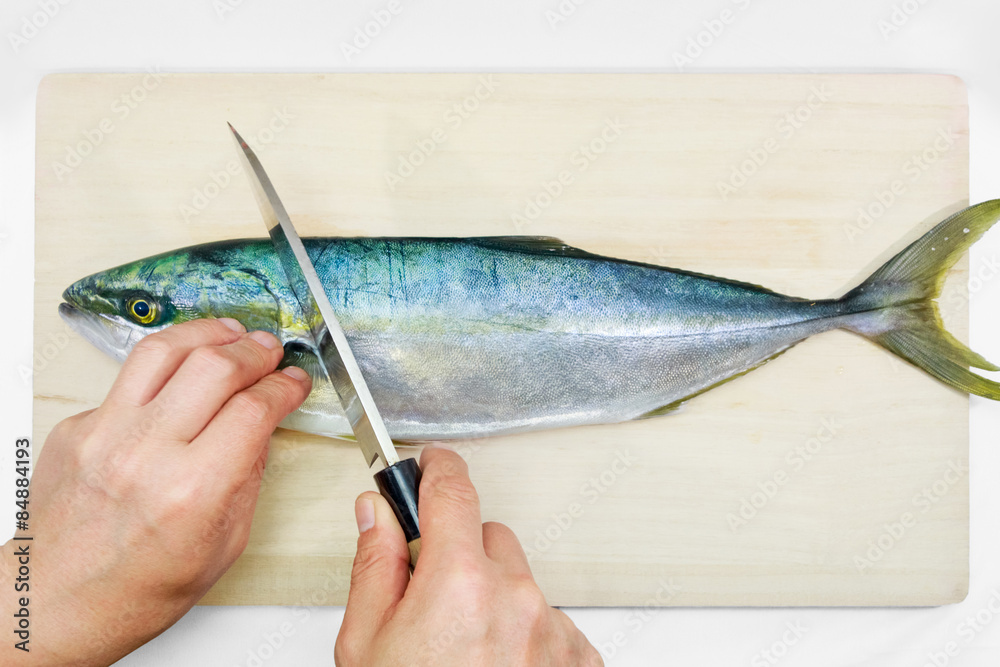 Preparing a Japanese yellowtail in the Japanese style Stock Photo ...