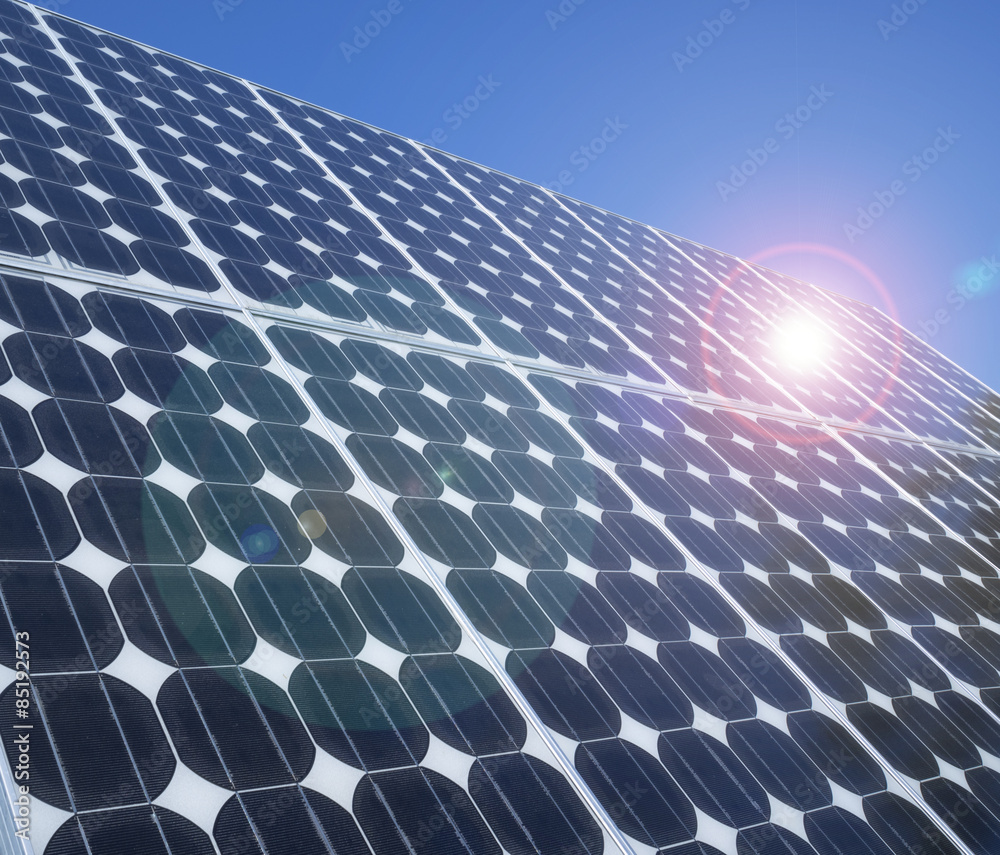 Photovoltaic cells solar panels lens flare copy space. Solar energy is ...