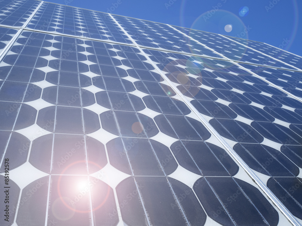 Lens flare solar panel photovoltaic cells copy space. Solar energy is ...