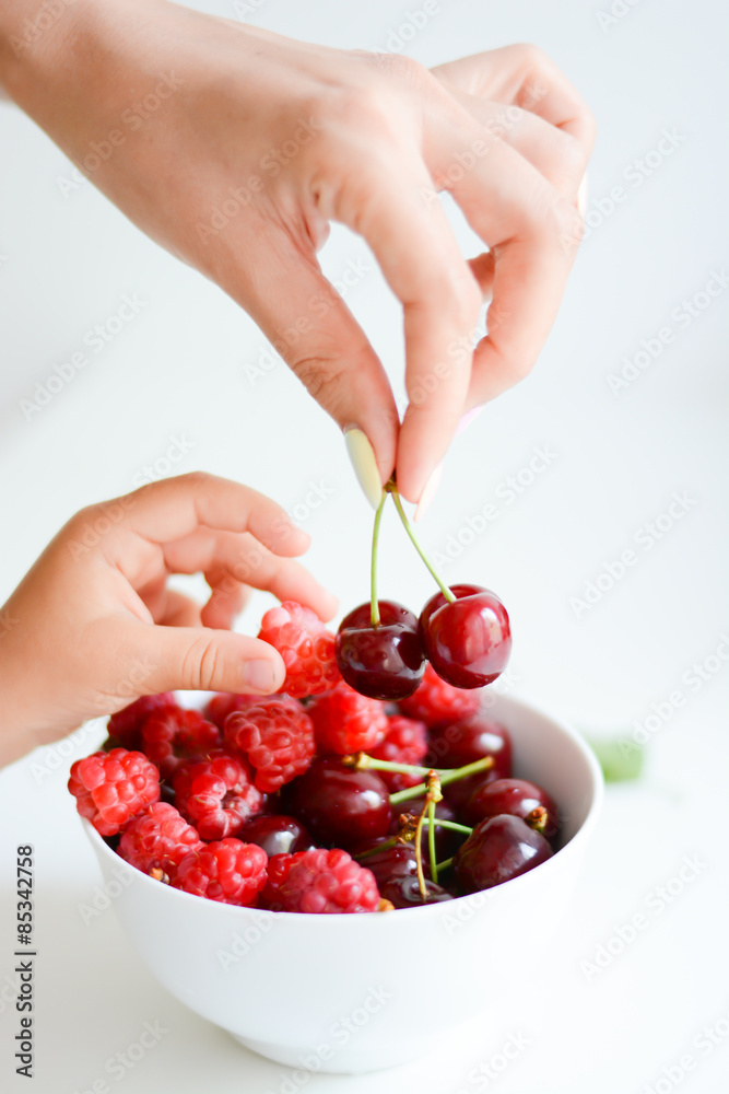 Child eating fruits by hand Stock Photo | Adobe Stock