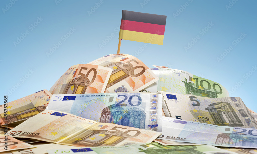 Flag of Germany sticking in a pile of various european banknotes Stock ...