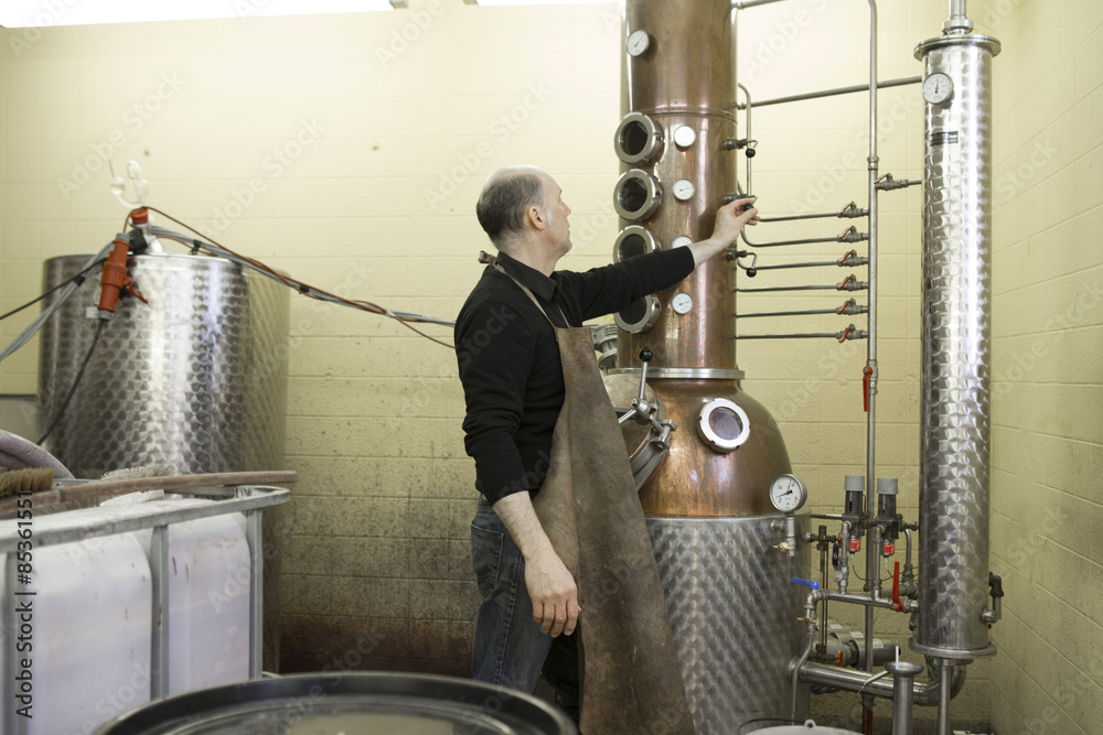 Distiller in distillery Stock Photo | Adobe Stock
