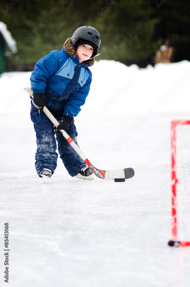 little boy ice skating outdoors Stock Photo | Adobe Stock