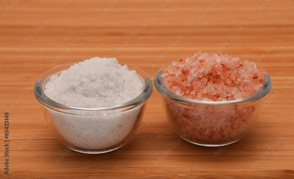 Choose your salt - Himalayan or rock salt (side view) on wooden Stock ...
