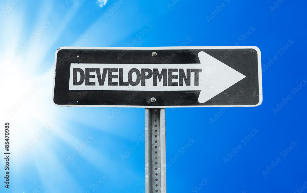 Development direction sign with a beautiful day Stock Photo | Adobe Stock