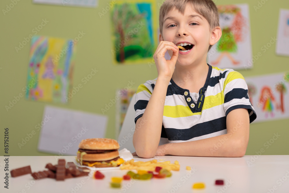 Kid and unhealthy snacks Stock Photo | Adobe Stock