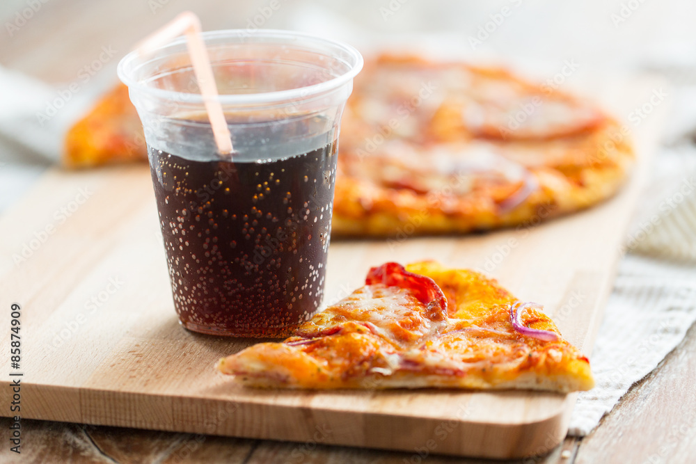 Pizza slice with cola soda drink on table Stock Photo | Adobe Stock
