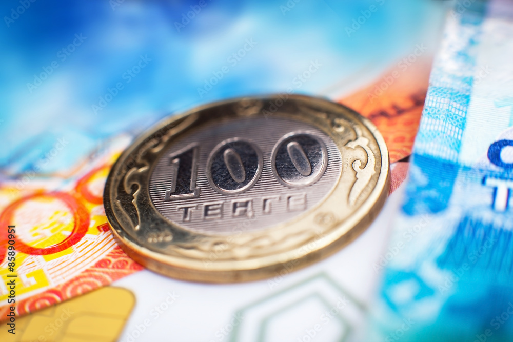 Kazakh tenge money/ /One hundred tenge lies at the center of a large ...