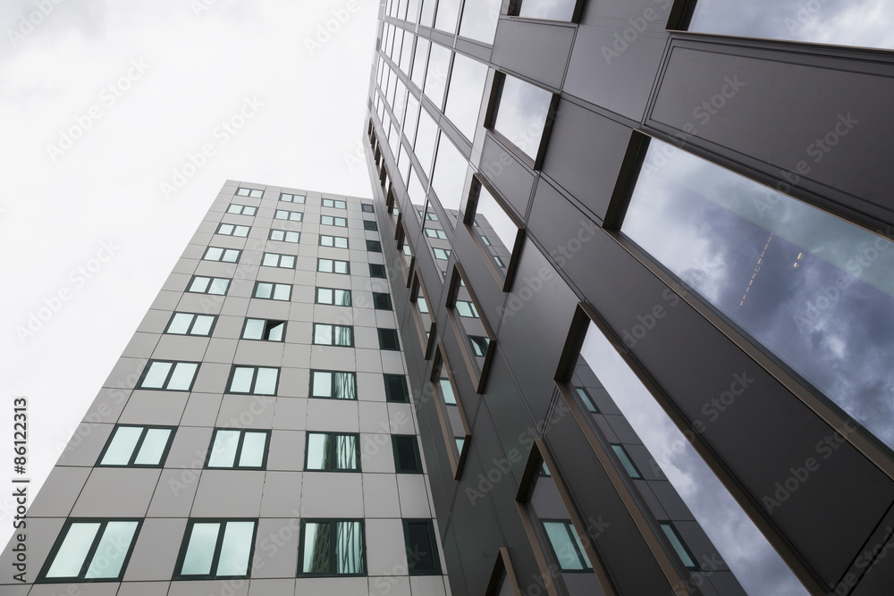 Poster modern facades of office buildings and reflections of clouds in ...