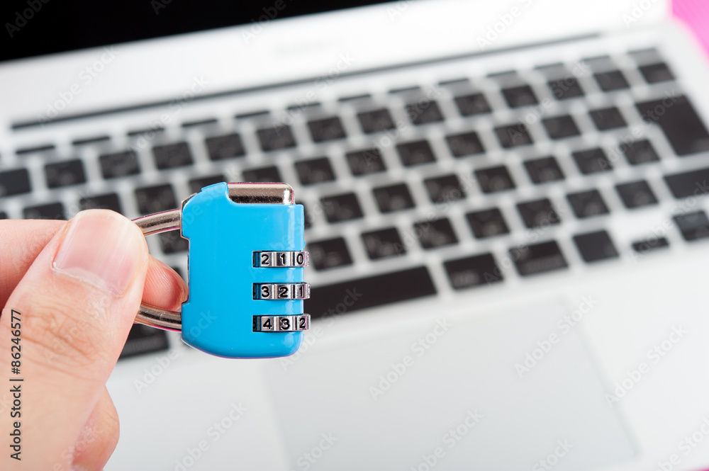 ノートパソコンと鍵 Stock Photo | Adobe Stock