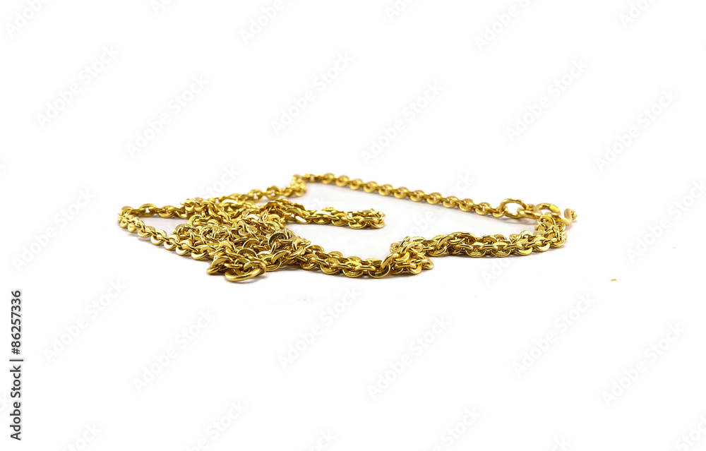 Gold chain jewely focusing at the front and blurred in depth isolated ...