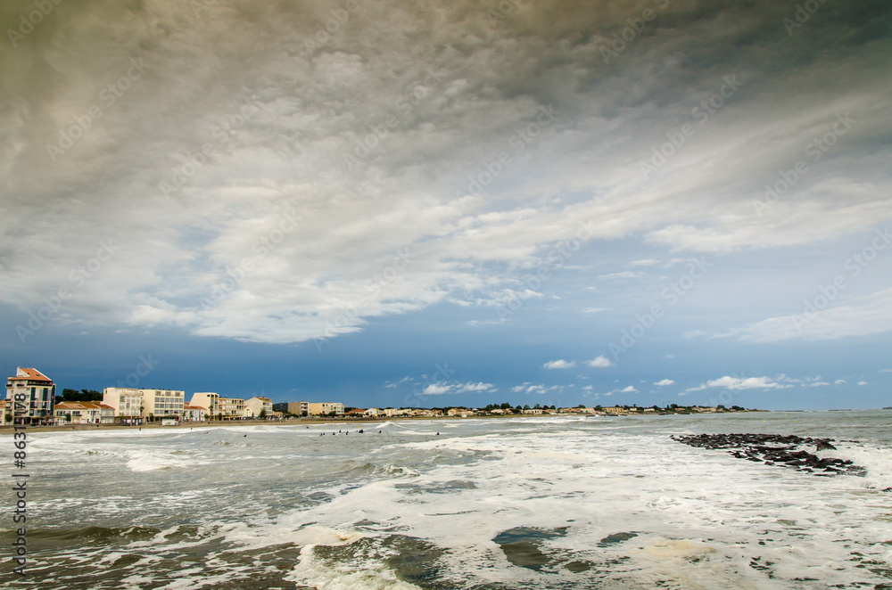 Surfer am Strand von Grau d'Agde Stock Photo | Adobe Stock
