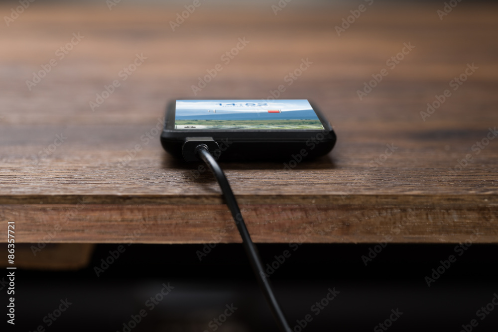 Mobile Phone On Charge Stock Photo | Adobe Stock