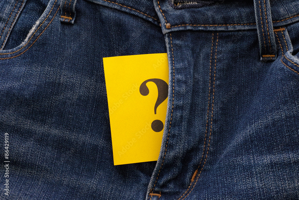 Yellow paper note with question mark appears out in jeans fly Stock ...