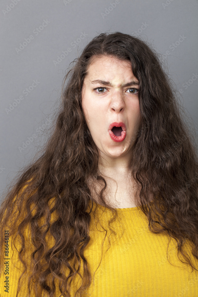 angry overweight 20's woman with long brown hair screaming loud for ...