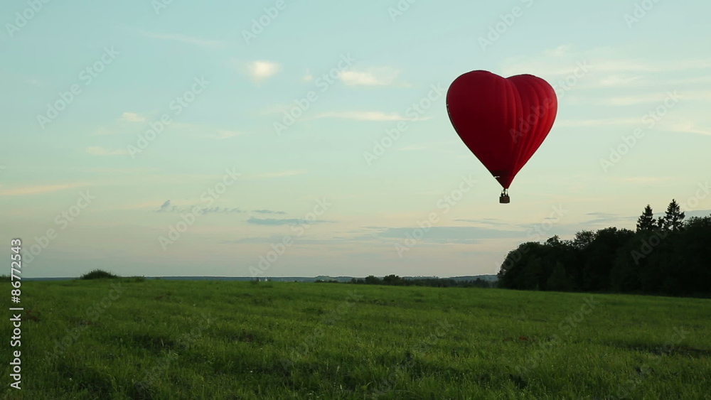 hot air balloons flying over field in countryside Stock Video | Adobe Stock