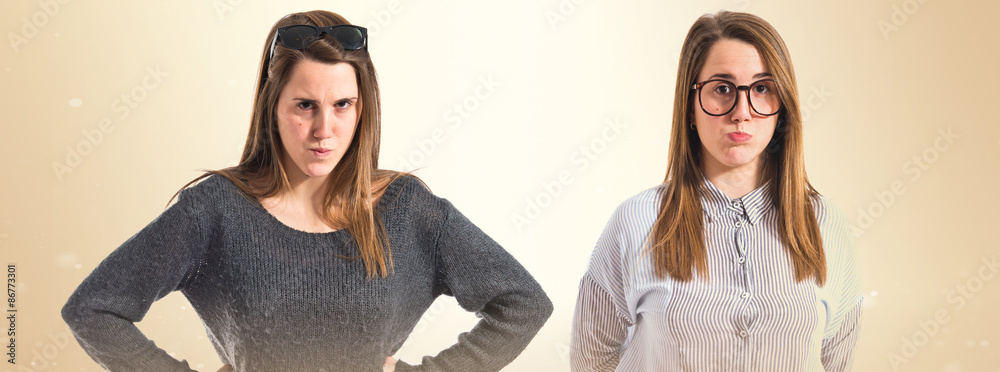 Sad twin sisters Stock Photo | Adobe Stock