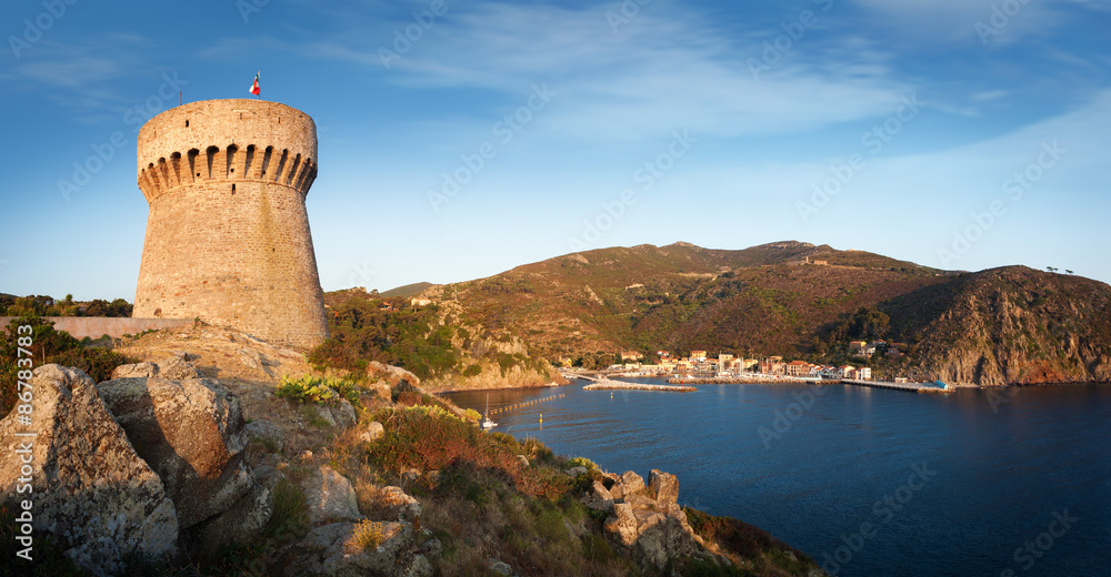 Panorama of Capraia harbour, rocks and yacht in bay on Capraia Stock ...