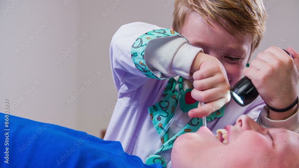 Doctor puts spoon in patient mouth Stock Video | Adobe Stock