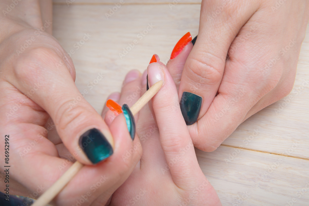 Pushing back cuticles, manicure process Stock Photo | Adobe Stock