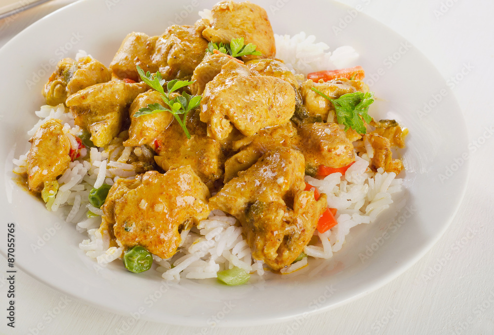 Curry and rice on white plate. Stock Photo | Adobe Stock
