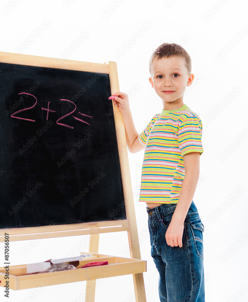 Preschooler child standing nearby chalkboard Stock Photo | Adobe Stock