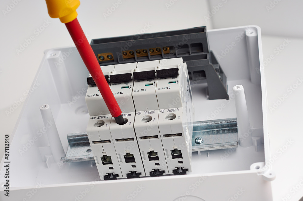 Electrical cabinet with four automatic fuses with screwdriver. Ready ...