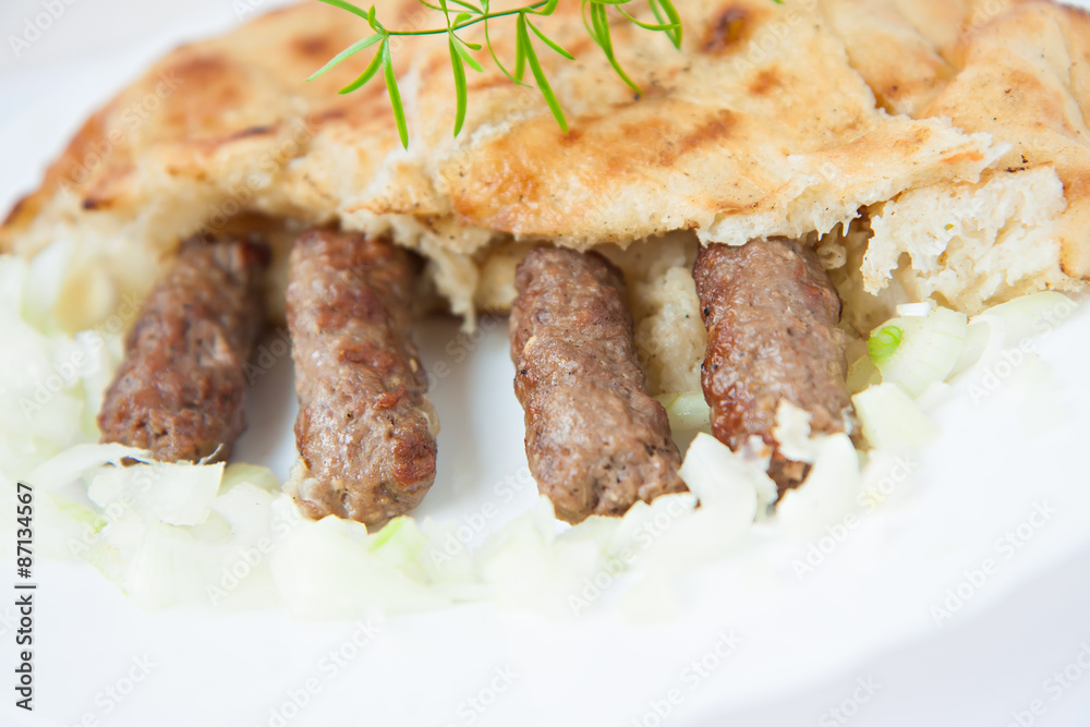 traditional bosnian food cevapi with flat bread and onion Stock Photo ...