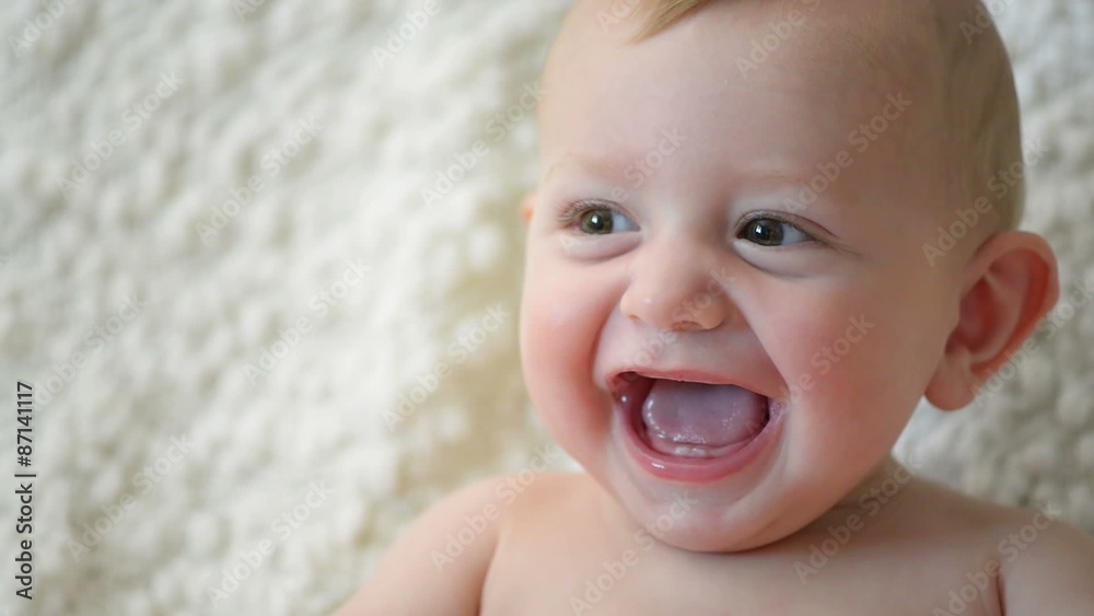Cute baby laughing and showing his first teeth Stock Video | Adobe Stock