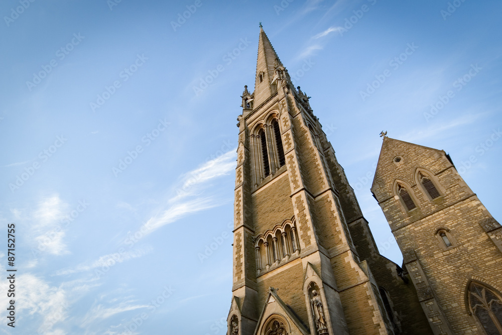 Traditional English Spired Church. A low, wide angle view up the spire ...