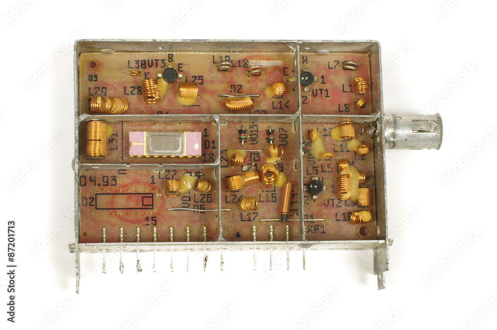 Old analog TV selector with tunable wire wound coils isolated on the ...