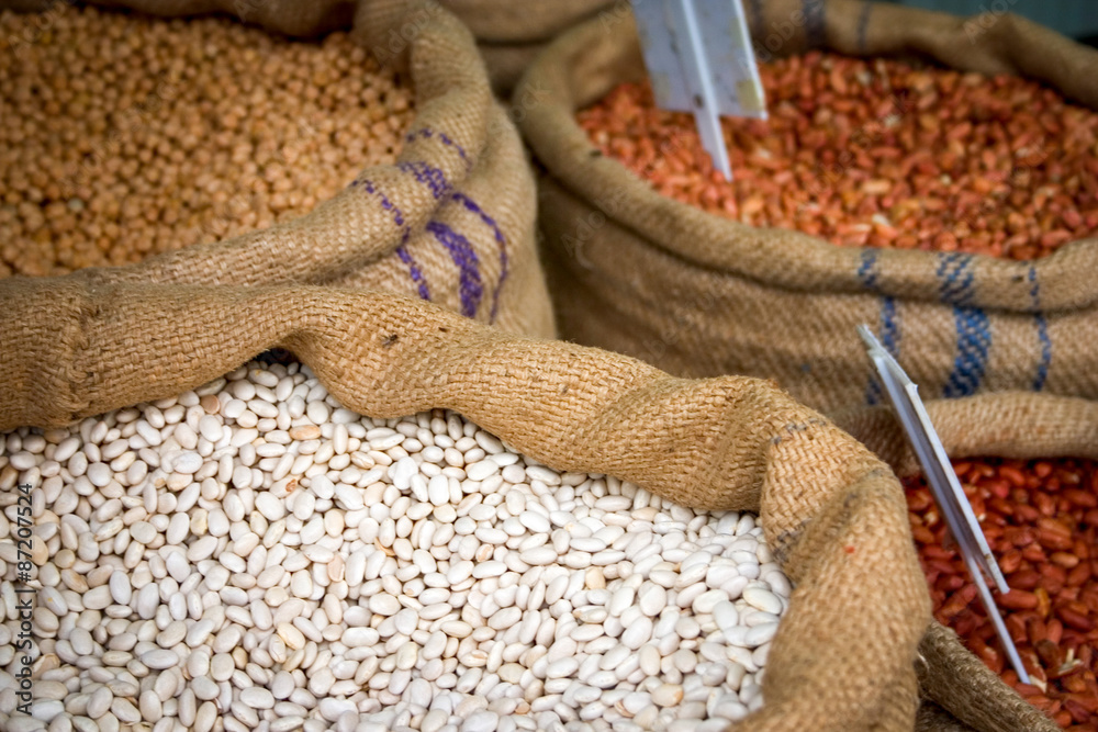 Hessian sacks of beans. Detail from a street market scene in Tunisia ...