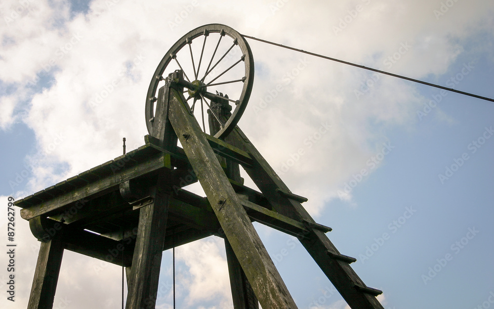 Vintage Coal Mining. An old Victorian mining wheel at the head of a now ...