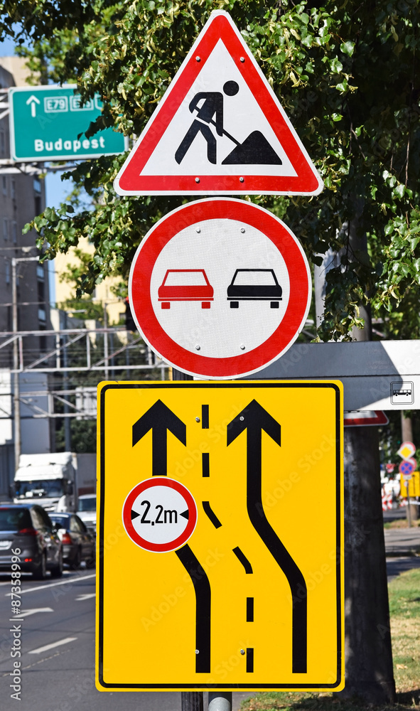 Road works, no overtaking and arrow road signs at the road construction ...