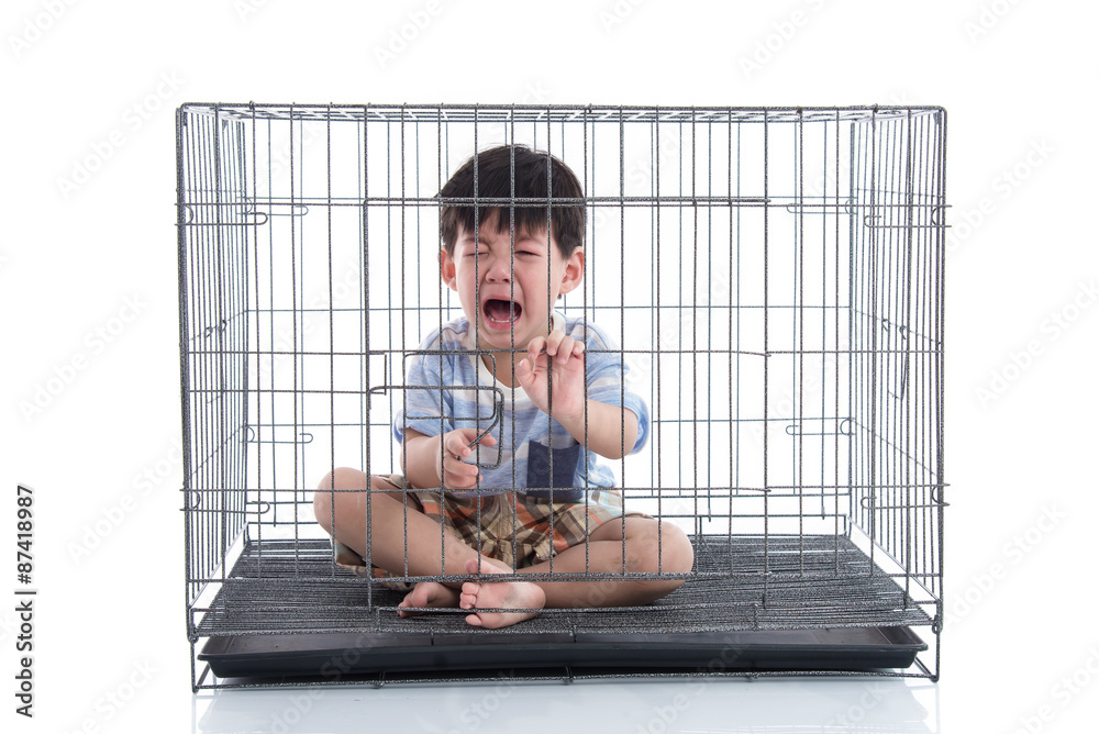 Zdjęcie Stock: Little asian boy crying in a cage | Adobe Stock