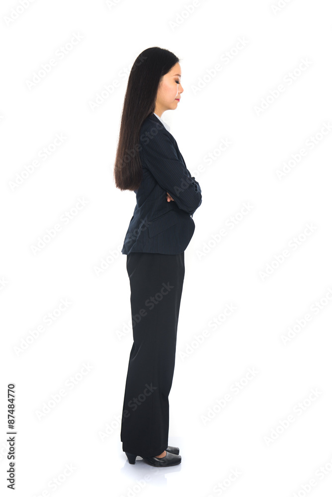 Side view of Asian business woman thinking, full length portrait Stock ...
