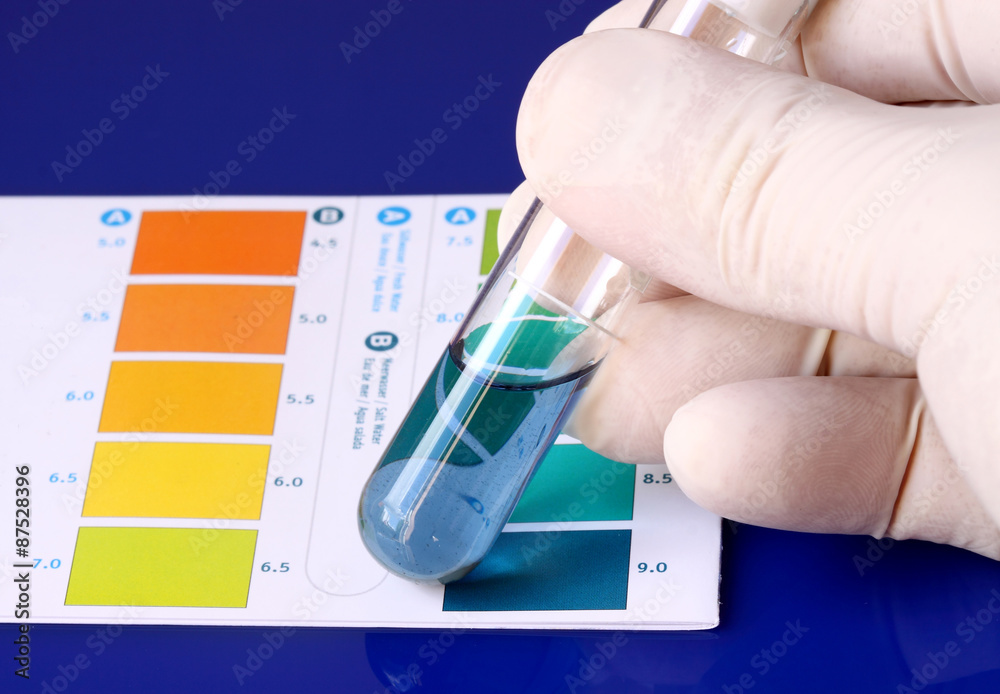 PH testing. Person measuring the PH scale of a chemical. Stock Photo ...