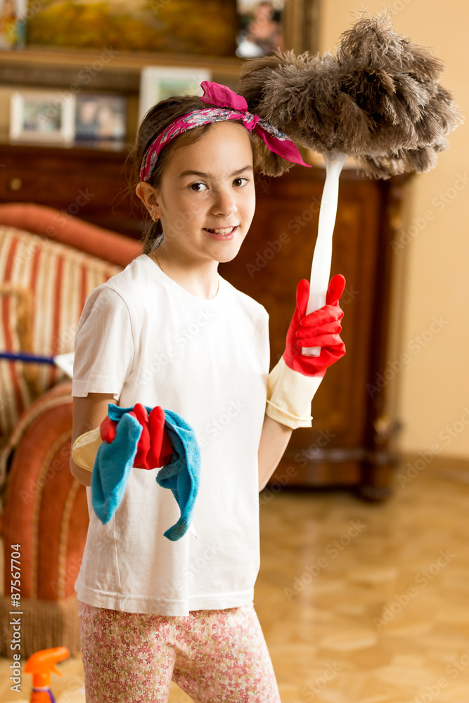 teen girl cleaning living room with cloth and feather brush Stock Photo ...