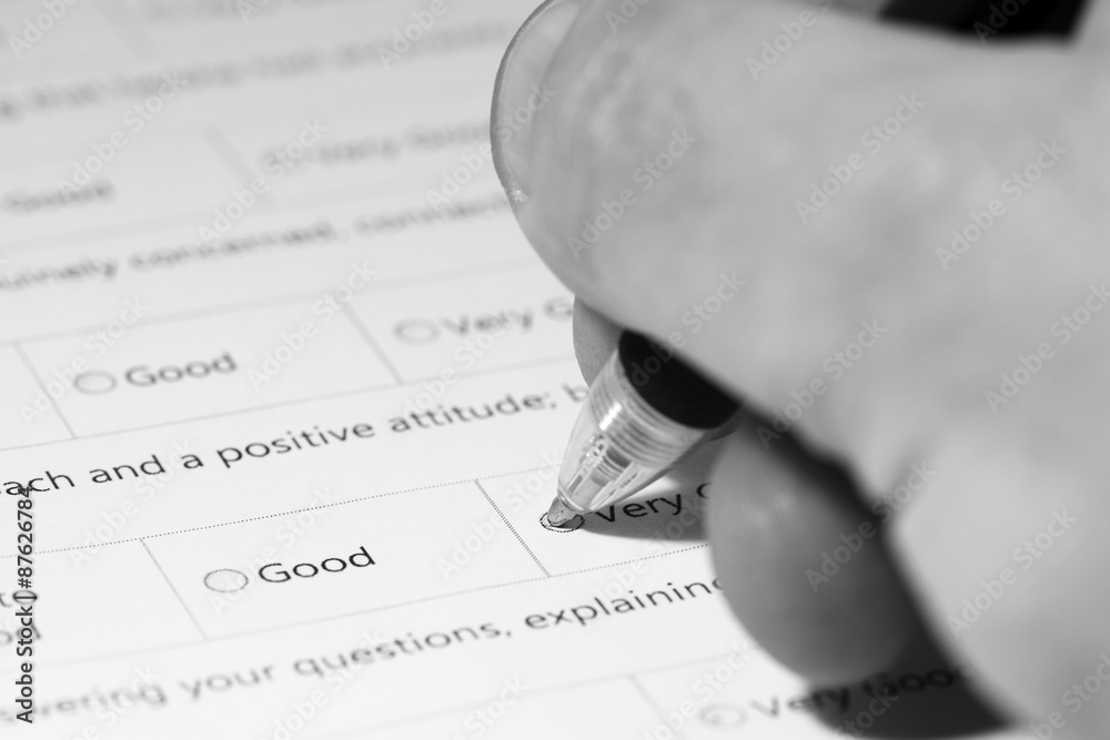 Filling in questionnaire. Man filling in a medical questionnaire. Stock ...