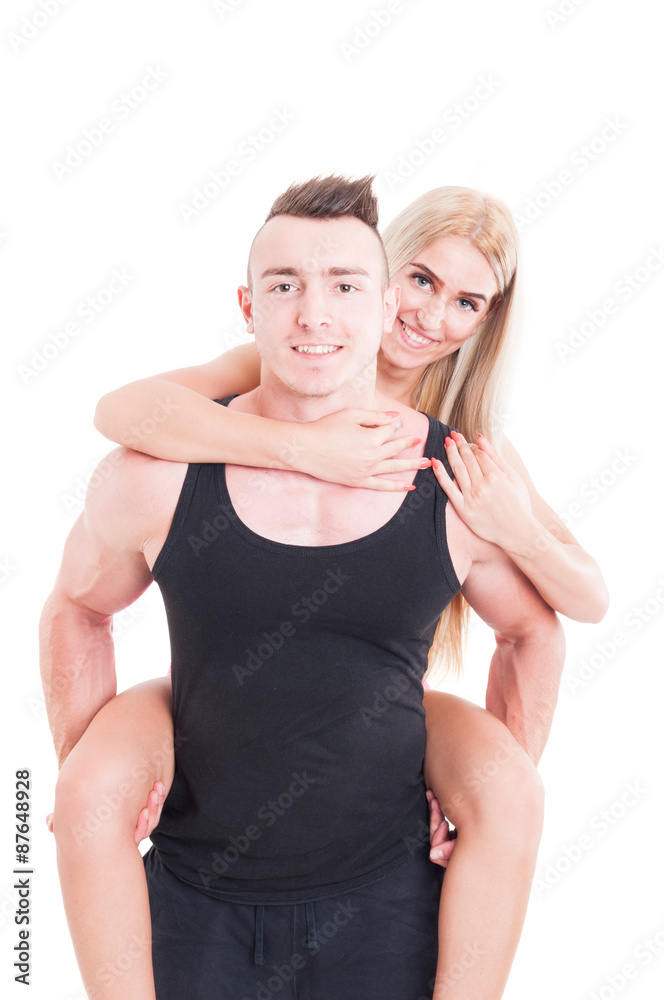 Strong bodybuilder holding fitness woman piggyback Stock Photo | Adobe ...