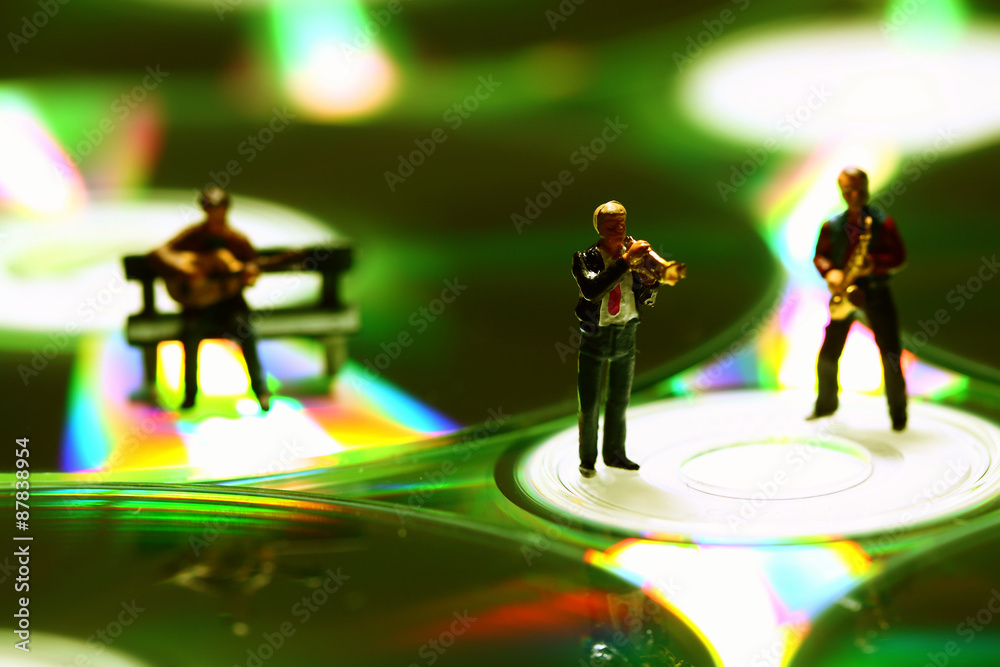 Miniature musicians CD. Miniature scale model musicians performing on a ...