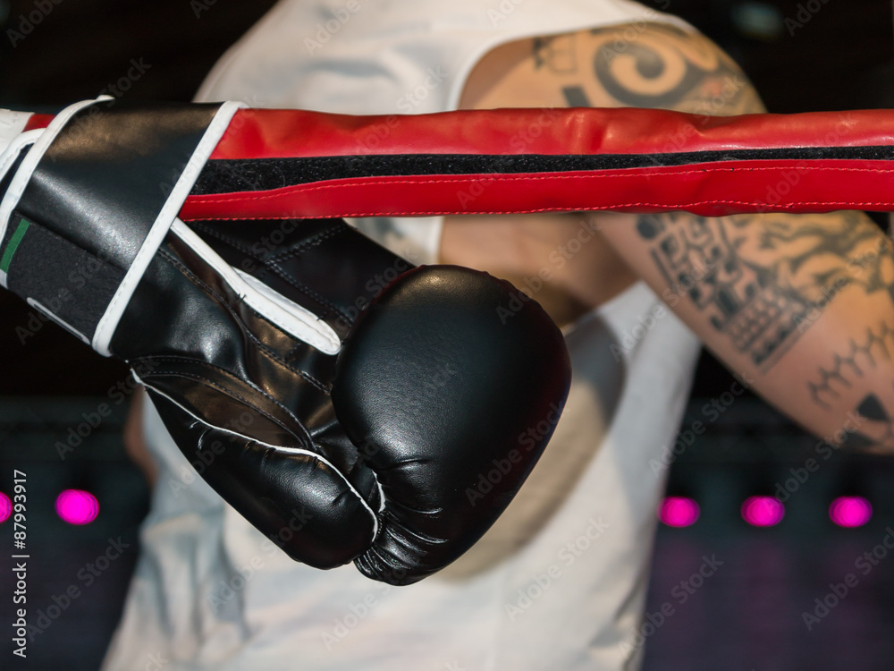 Black Boxing Glove Tied to Ring Ropes Stock Photo | Adobe Stock