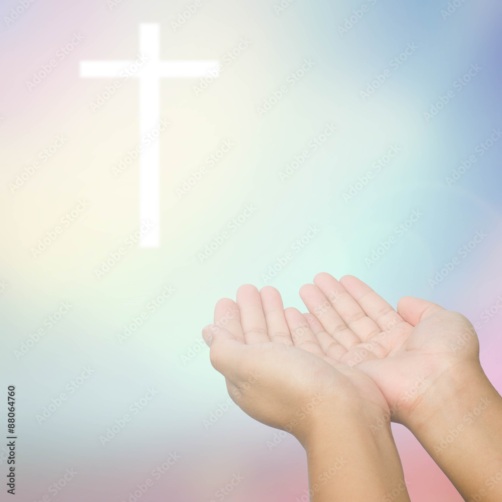 open hands praying the cross on blur sky background. Stock Photo ...