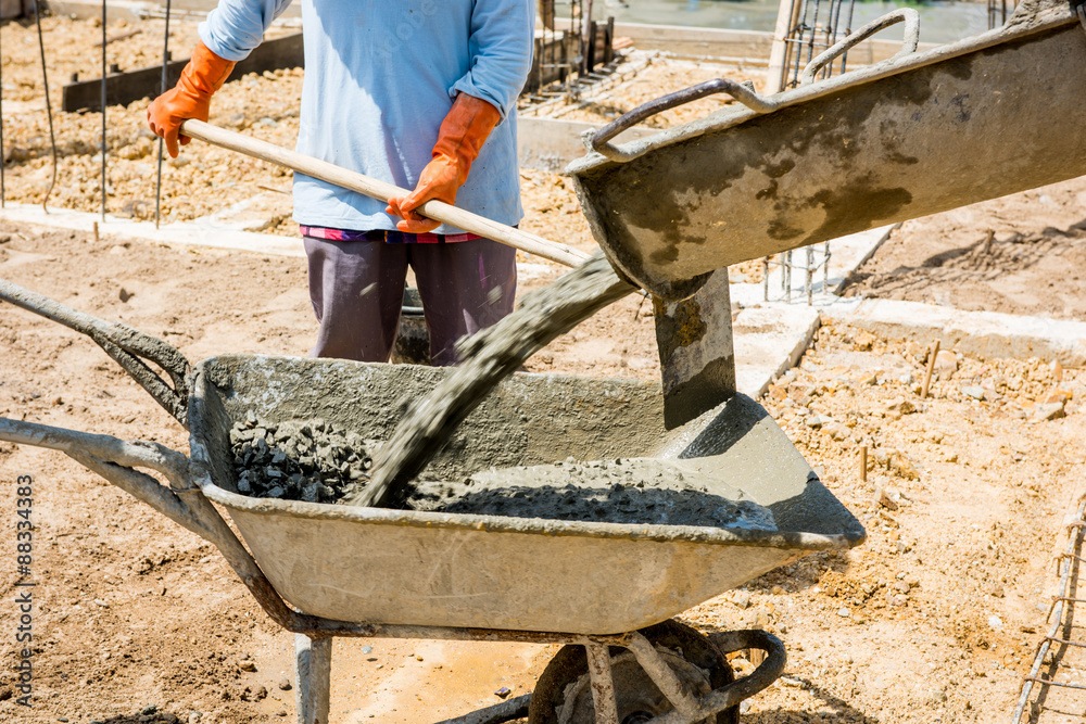 Concrete pouring during commercial concreting floors of building Stock ...
