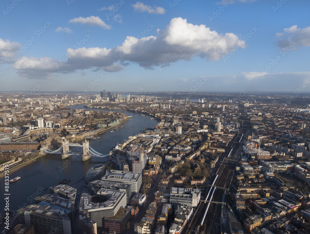 Aerial cityscape showing River Thames, Tower Bridge and railway tracks ...