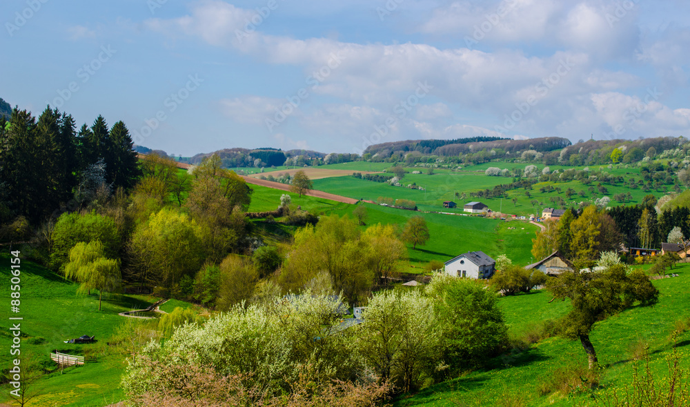 Typical countryside in luxembourg with small villages, forests, meadows ...