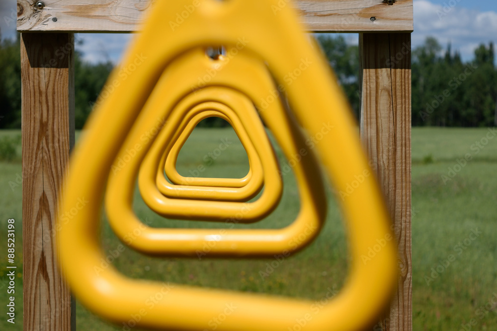Closeup Looking Through Yellow Monkey Bar Rings Stock Photo | Adobe Stock