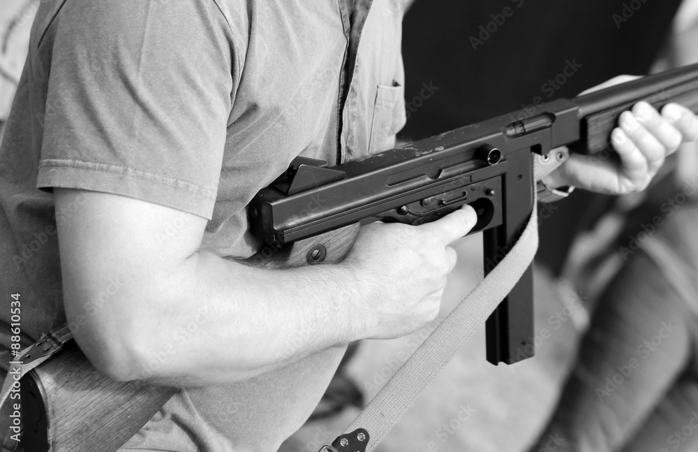 soldier in uniform with a submachine gun in his hand Stock Photo ...